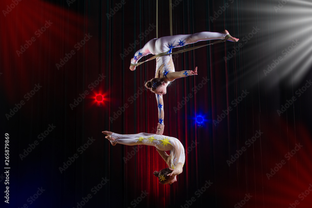 Circus actress acrobat performance. Two girls perform acrobatic ...
