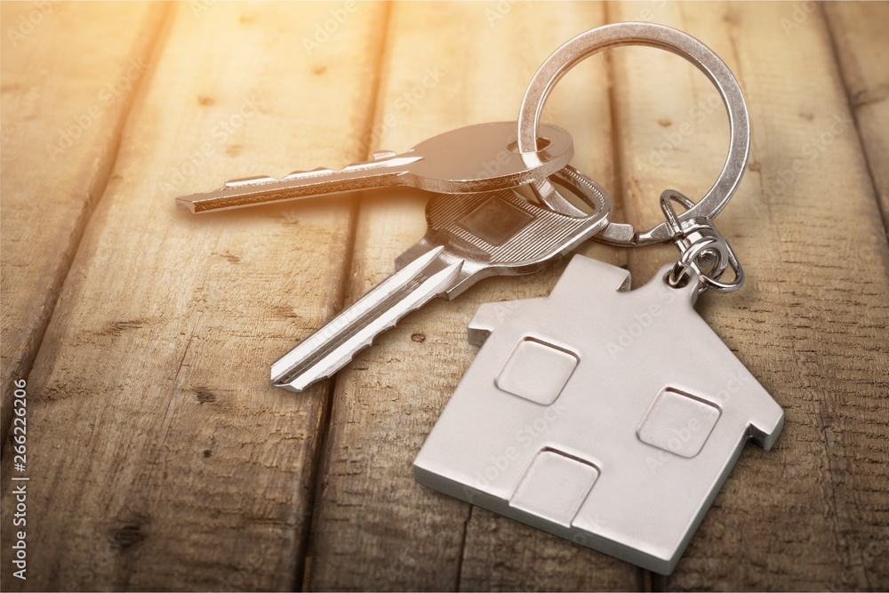 Stock-Foto „House keys with house figure on background“ | Adobe Stock