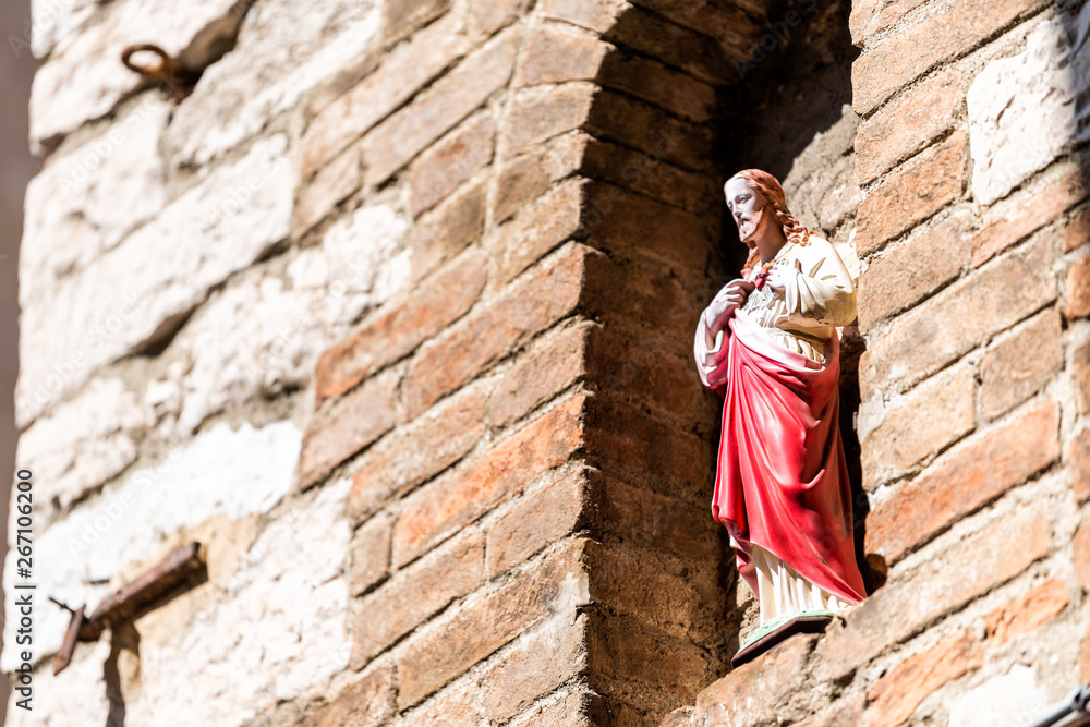 Jesus Christ sculpture statue on window sill in Umbria, Italy closeup ...