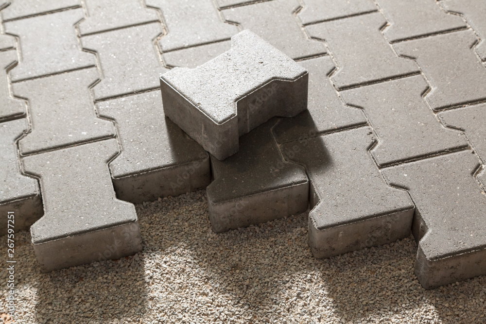 Building an pedestrian path with paver bricks. Sidewalk pavement Stock ...