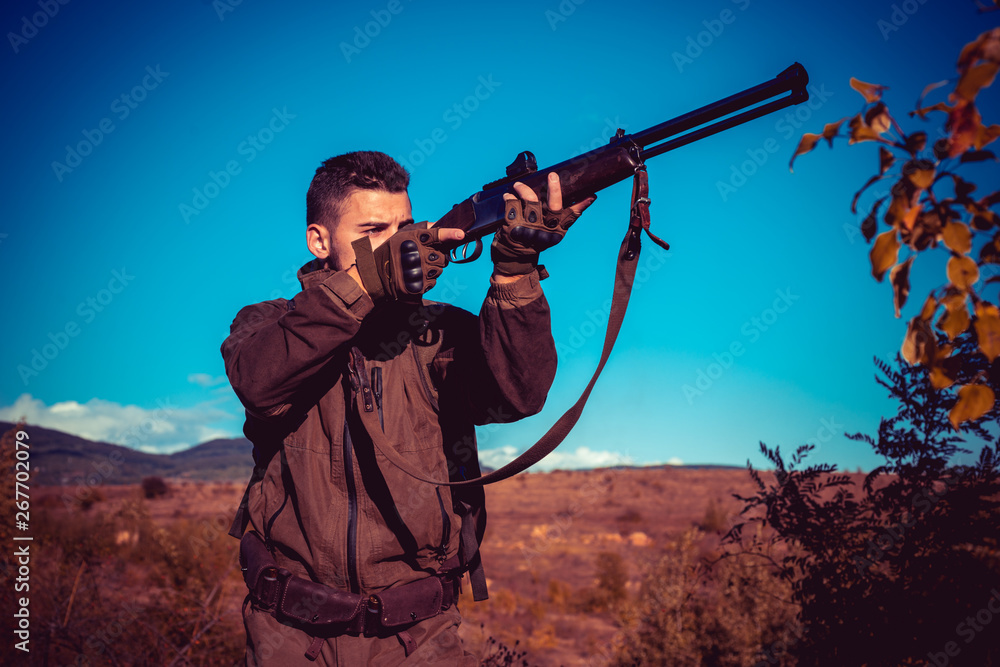 Hunter with shotgun gun on hunt. Calibers of hunting rifles. Hunter ...
