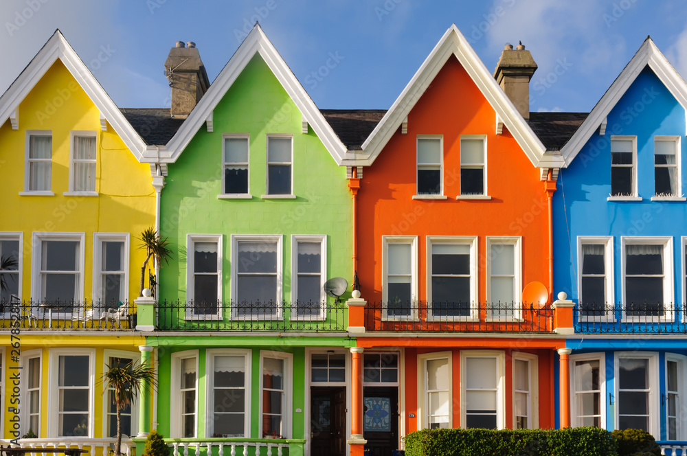 Row of brightly painted multicoloured houses in Whitehead, Northern ...