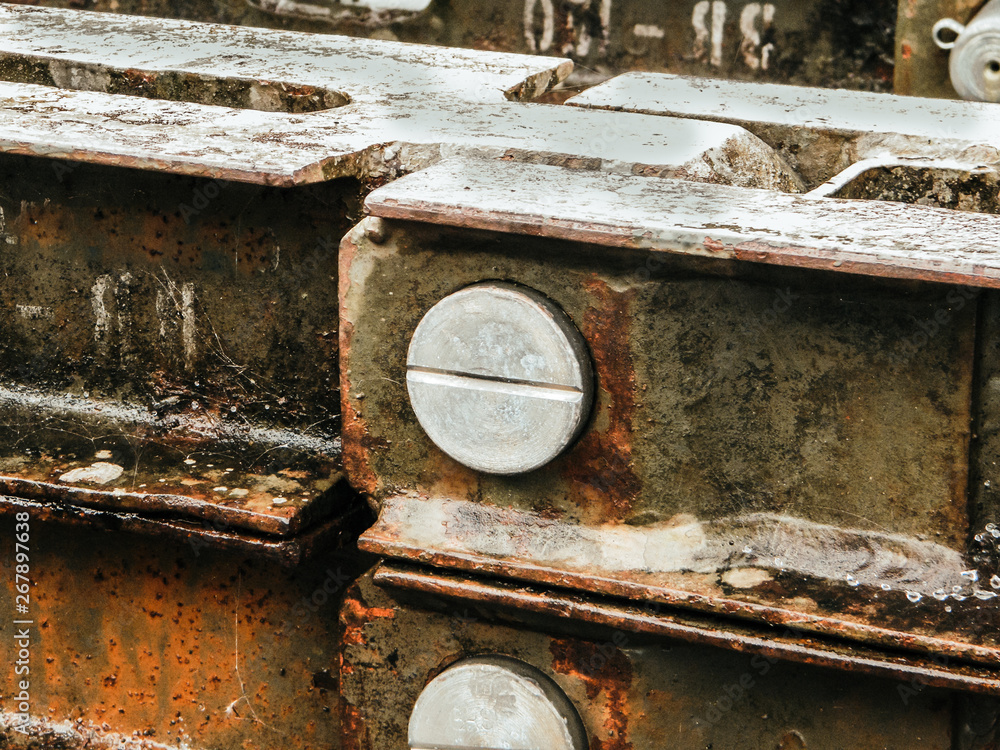 Nut bolt screw fastened in Old zinc rusty grunge galvanized corrugated ...