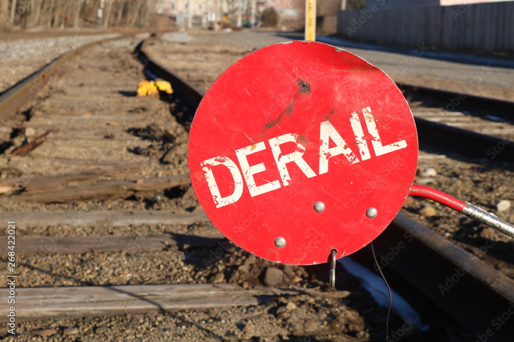 Red derail warning symbol sign on old abandoned railroad tracks Stock ...