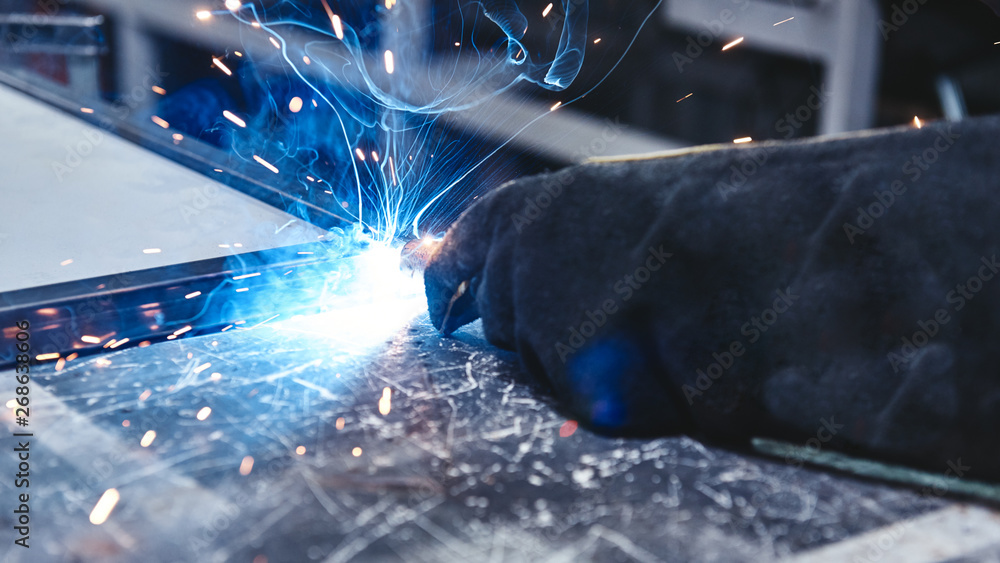 The better way to weld. Hand in glove hold welding steel. Welds with ...