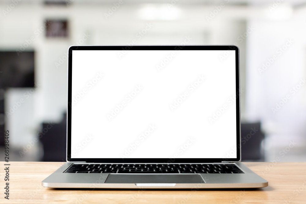 Laptop blank screen on wood table with office room background, mockup ...