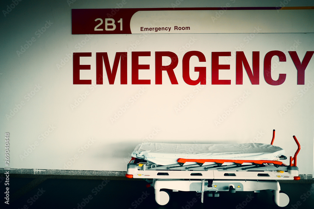 Red emergency room sign and patient bed that looks scary Stock Photo ...