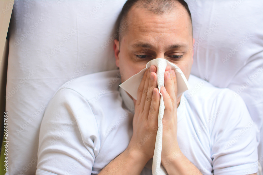 Sick man.Flu. man Caught Cold. Sneezing into Tissue. Headache. Virus ...