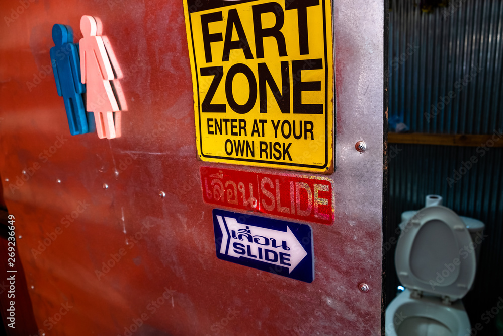 Red toilet sliding door with illustration of man and woman toilet sign ...