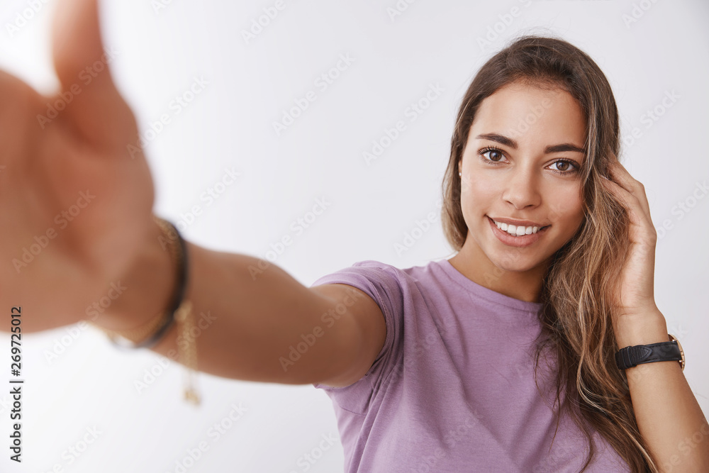 Attractive romantic flirty young 25s woman playing hairstyle messy hair ...