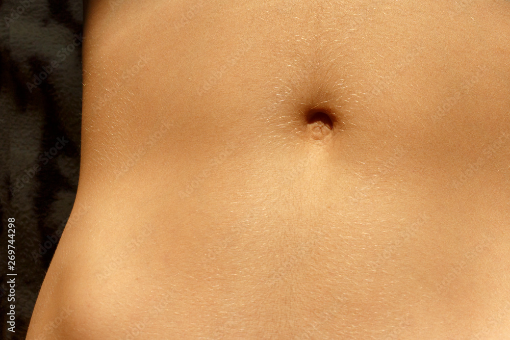belly of a young man. Closeup - navel of the stomach - belly button ...