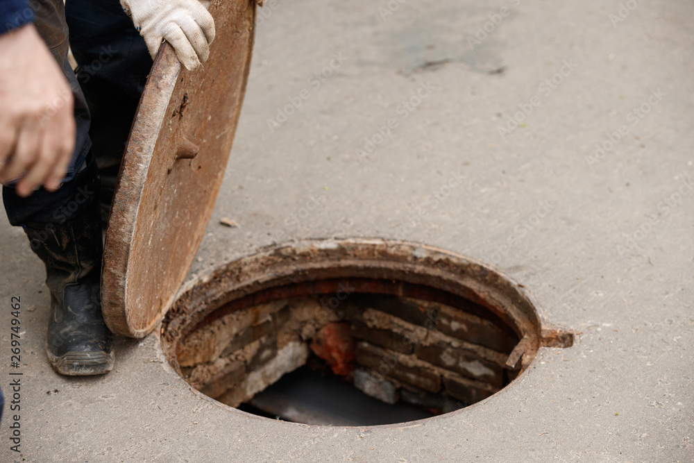 Dangerous open sewer manhole, a danger to people walking along the ...