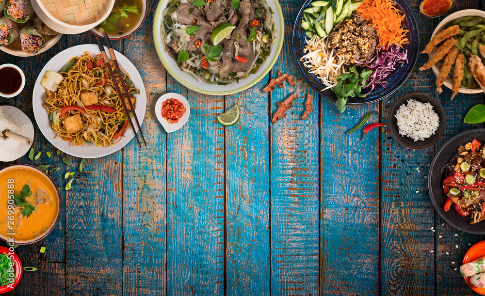 Asian food background with various ingredients on rustic wooden table ...