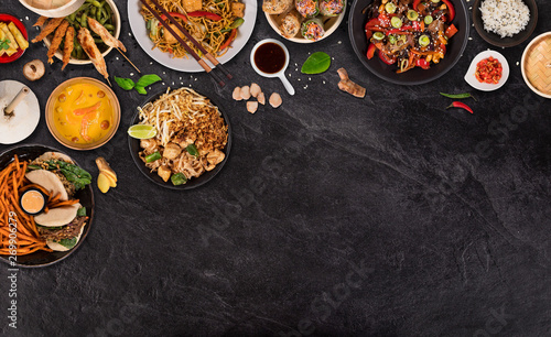 Asian food background with various ingredients on rustic stone ...