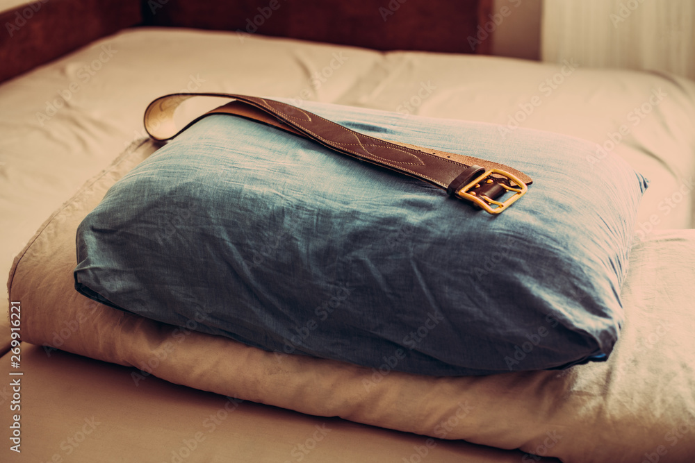 leather belt on the bed prepared for spanking. domestic discipline ...