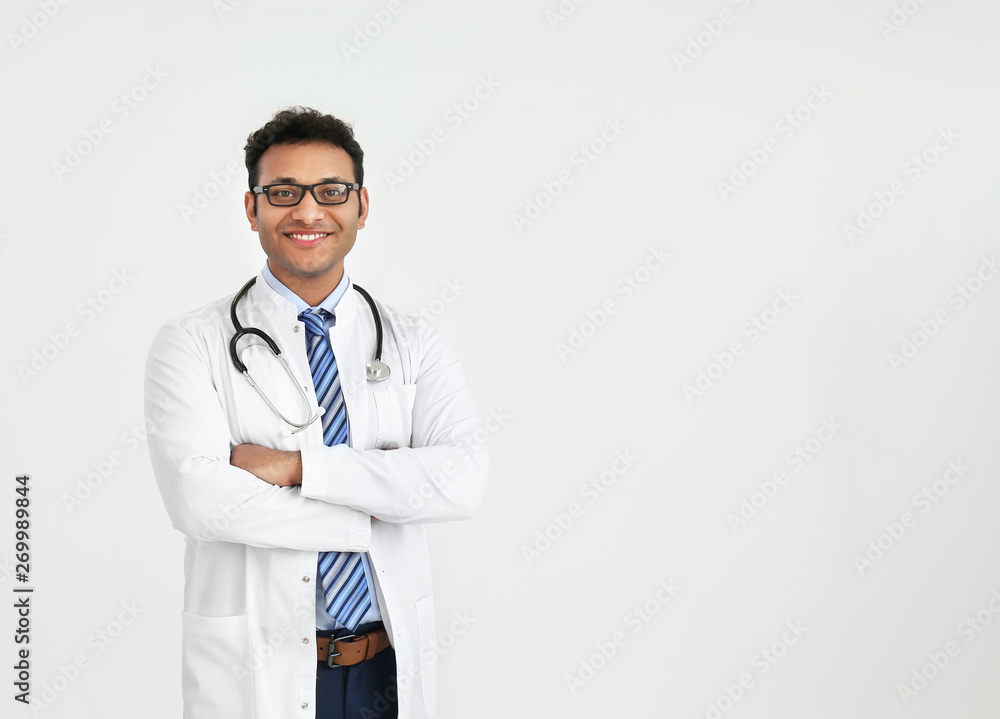 Handsome male doctor on white background Stock Photo | Adobe Stock