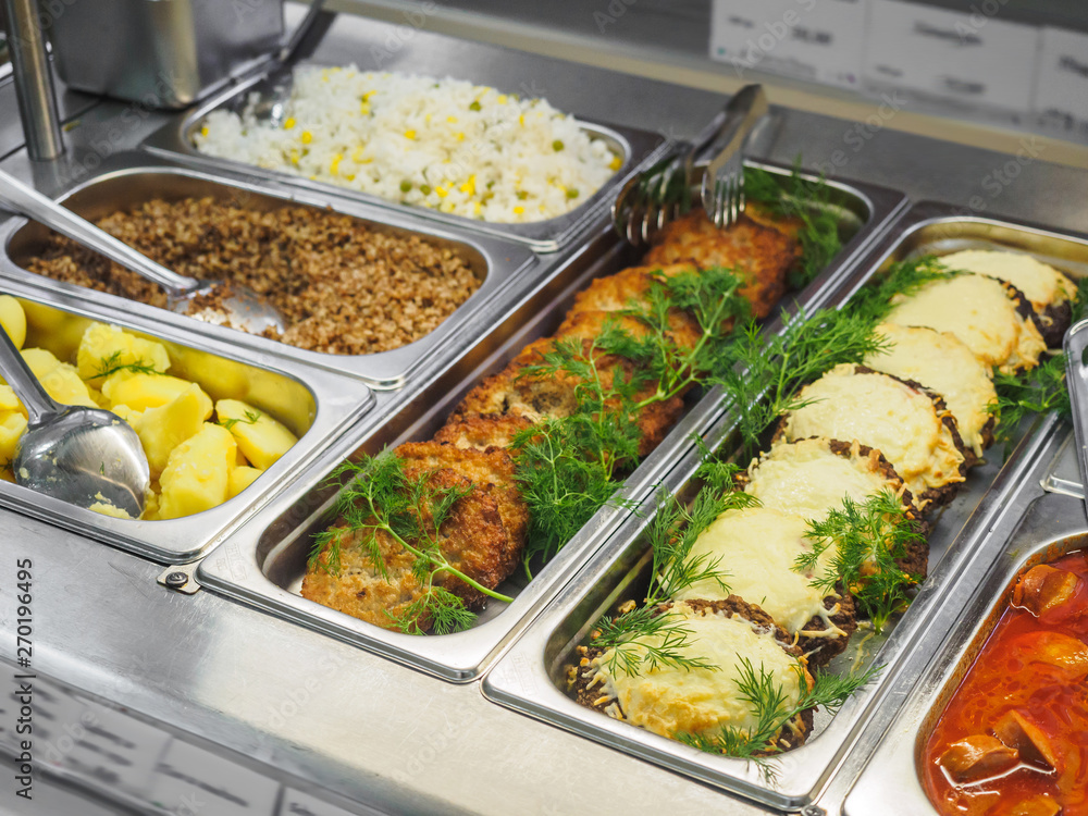 Cuisine cafeteria buffet with food. Self-service food display showcase ...