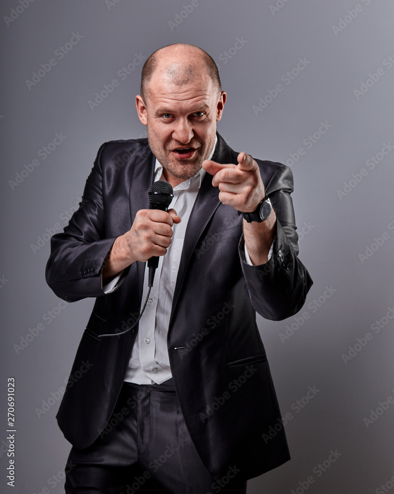 Fun emotional moving happy performer man presenting the show holding ...