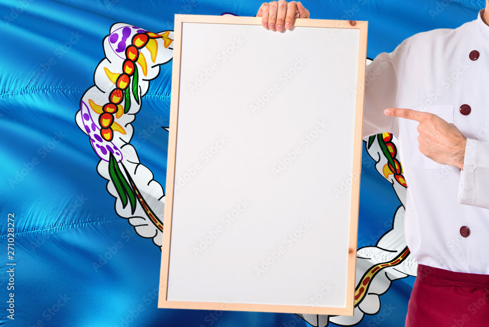 Chef holding blank whiteboard menu on Northern Mariana Islands flag ...