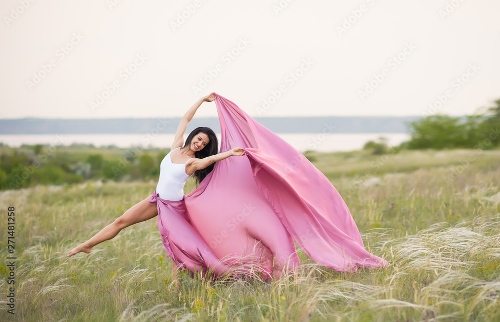 Classic dance on nature background. Professional female modern dancer ...