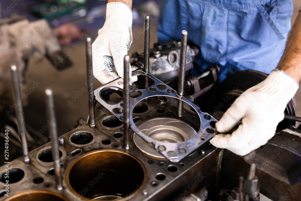 Mechanic opened the locking valve mechanism. Disassemble engine block ...