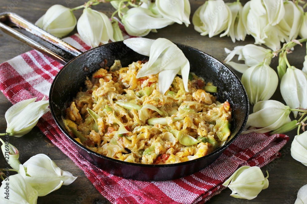 Yucca flowers dish. flower petals fried with eggs and tomatoes ...