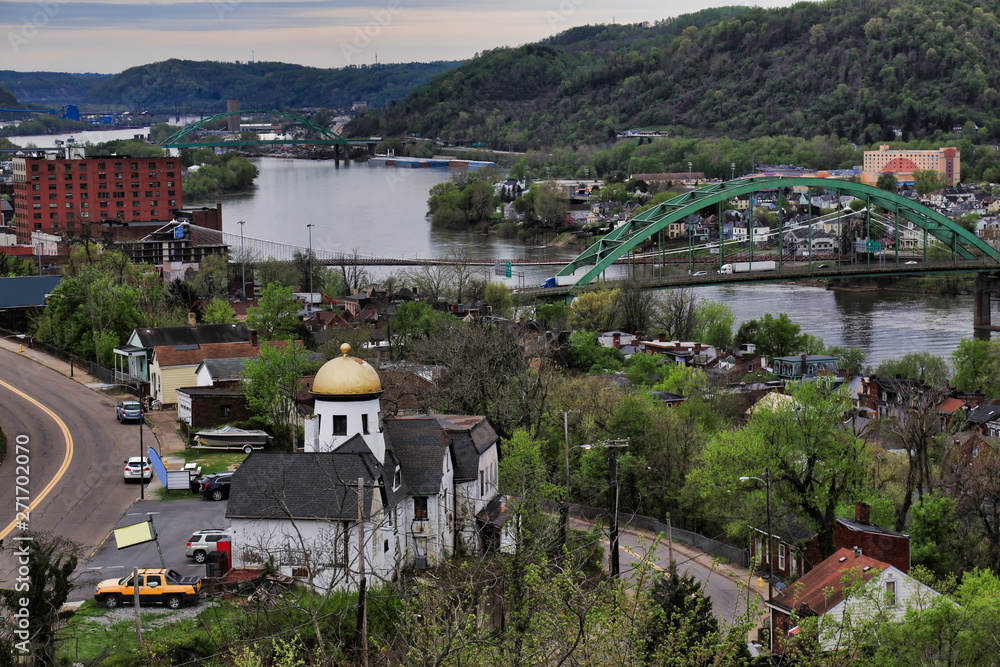 This is an aerial view of Wheeling, West Virginia along the Ohio River ...