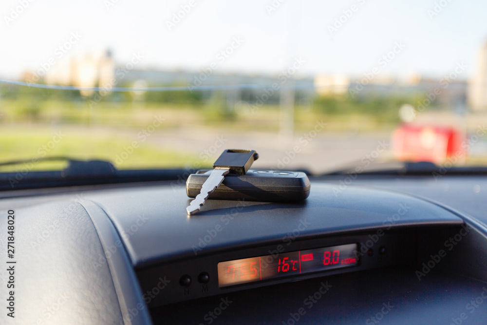Closeup inside vehicle of wireless key ignition. Start engine key. Car ...