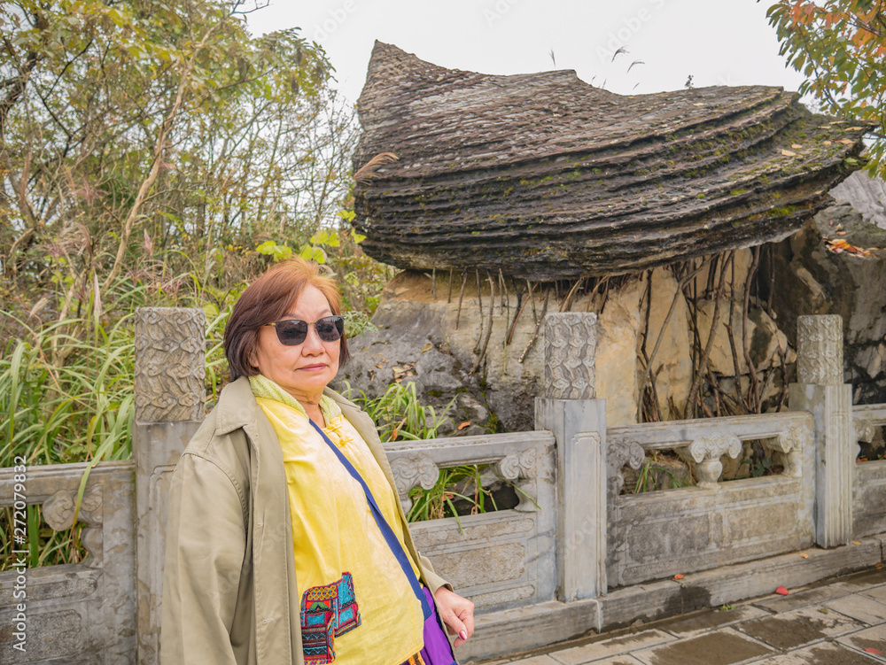 Beautiful senior asia women with Stone look like shell on tianmen ...
