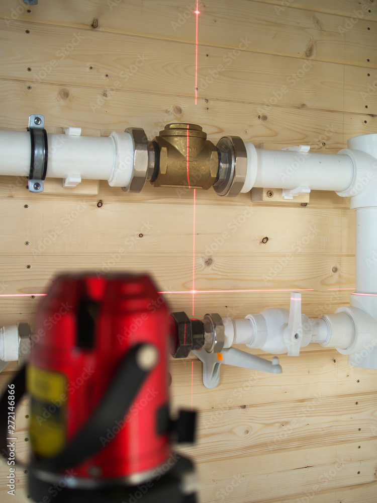 mounting of gravity heating system equipment with laser level in a ...