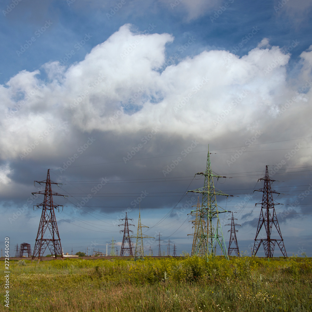 Powerful lines of electric gears.Power lines and sky with clouds.Wires ...