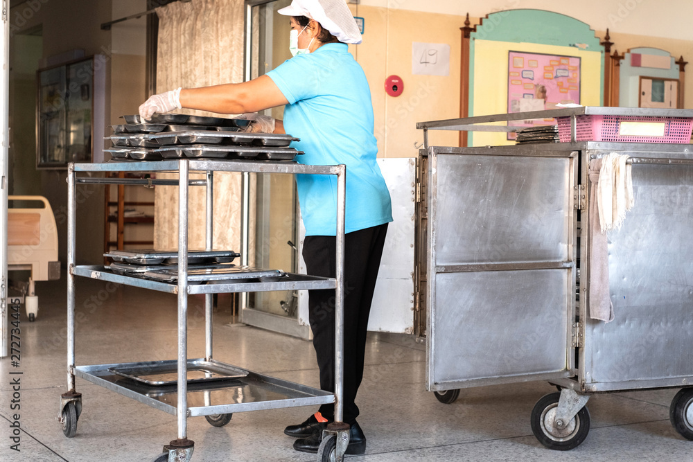 Woman nurse prepare food on cart at hospotal for patient. Stock Photo ...