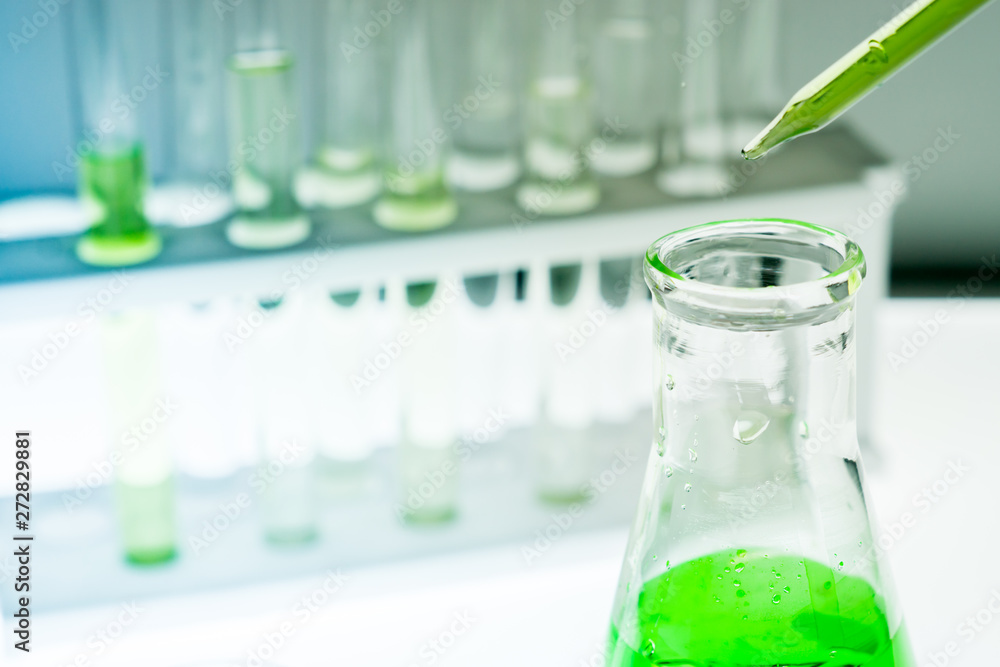 Sample dripping pipettes into Erlenmeyer bottles containing chemical ...