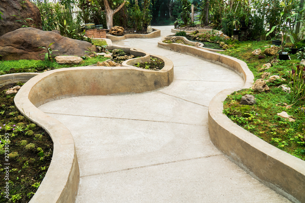 Curve Concrete footpath in park background. Bend cement pavement in the ...