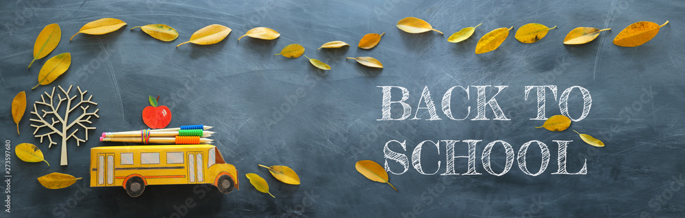 Back to school concept. Top view banner of cardboard school bus, apple ...