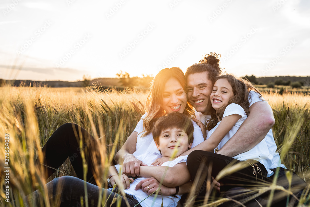 Portrait of a happy and fun family in the countryside. Concept of ...