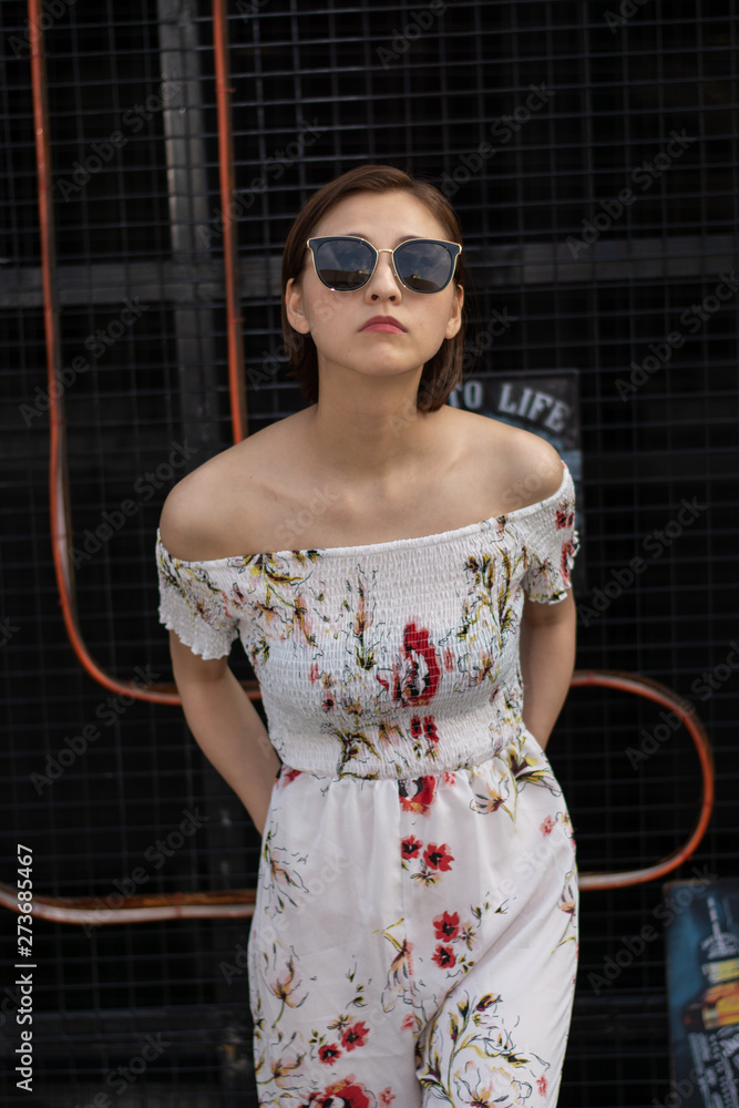 Asian Chinese model girl influencer street shot. Wearing white printed ...