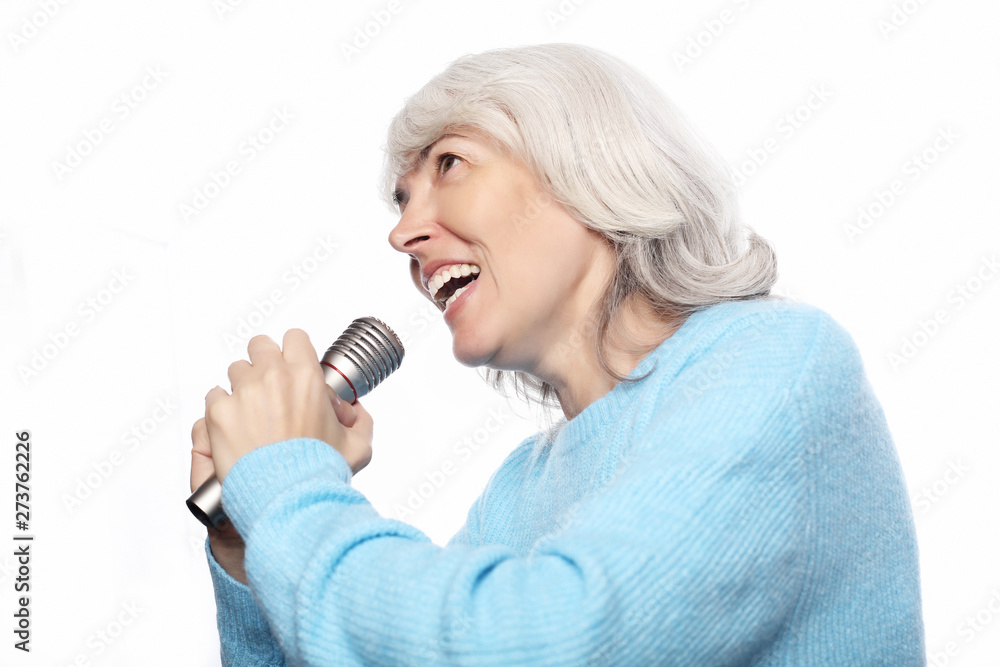 lifestyle, emotion and people concept: Happy old senior woman singing ...