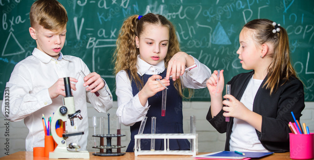 students doing experiments with microscope. Happy children. Chemistry ...