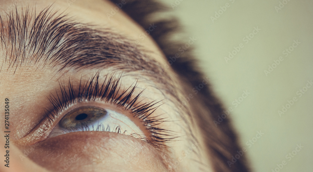 a man drips open human eye with bright red arteries drops to improve ...