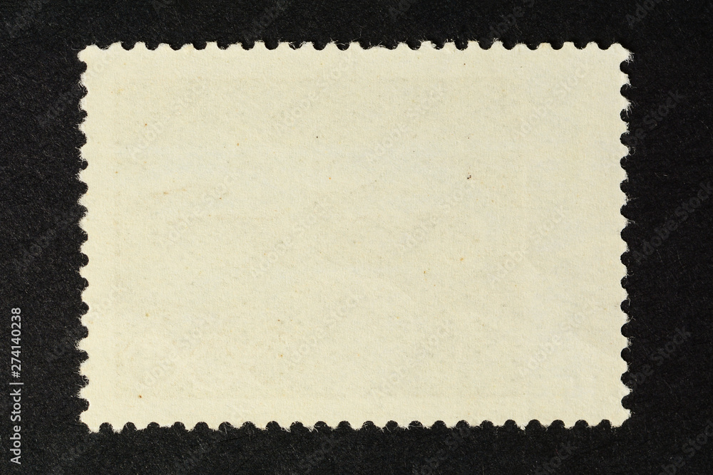 Blank vintage postage stamp on black background. Mockup with ...
