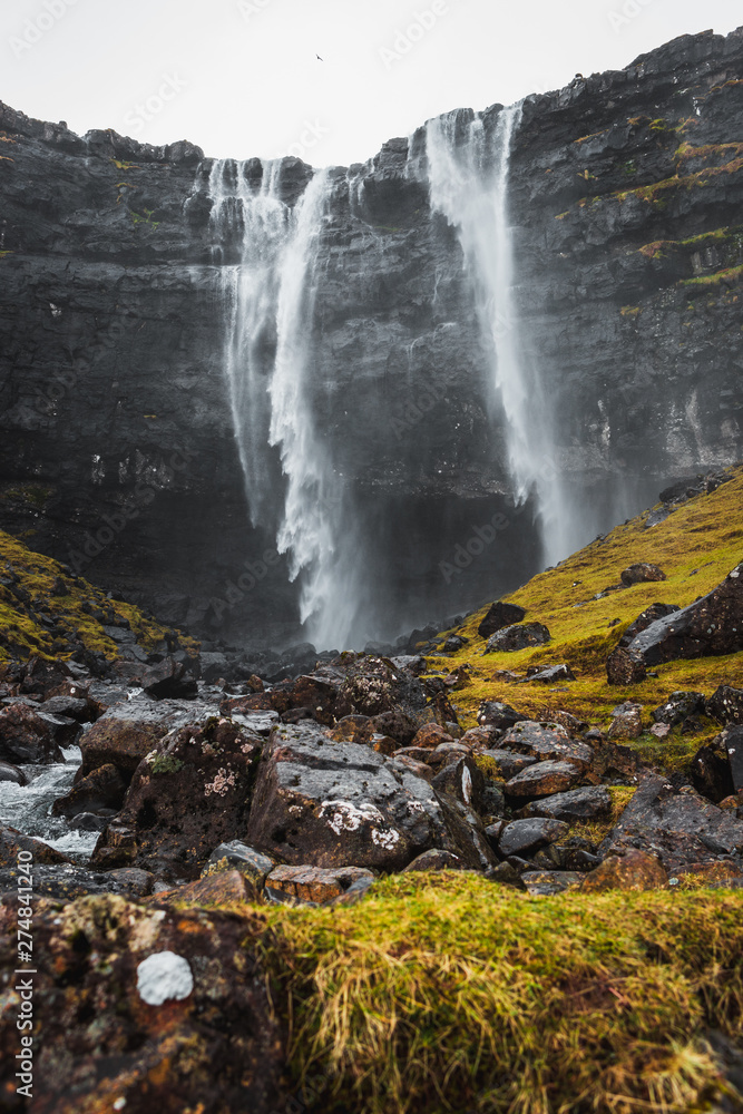 Fossa, the largest waterfall on the Faroe Islands, as seen during early ...