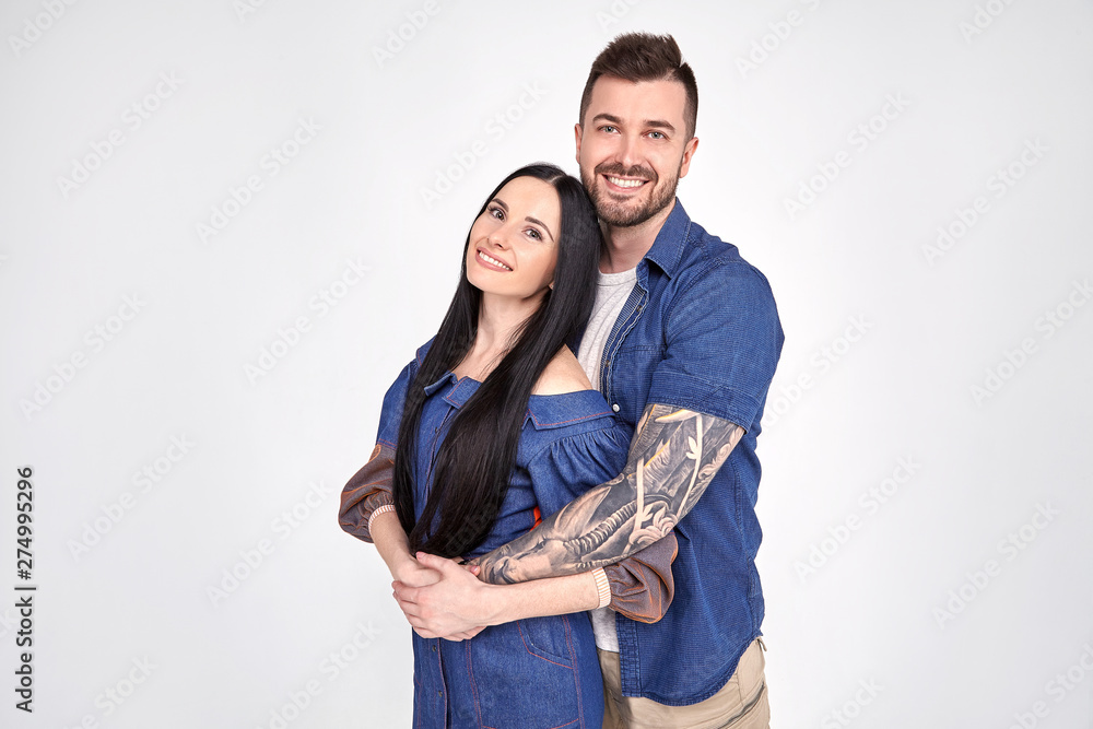Lovely couple have warm cuddle, pose for family portrait, smile ...