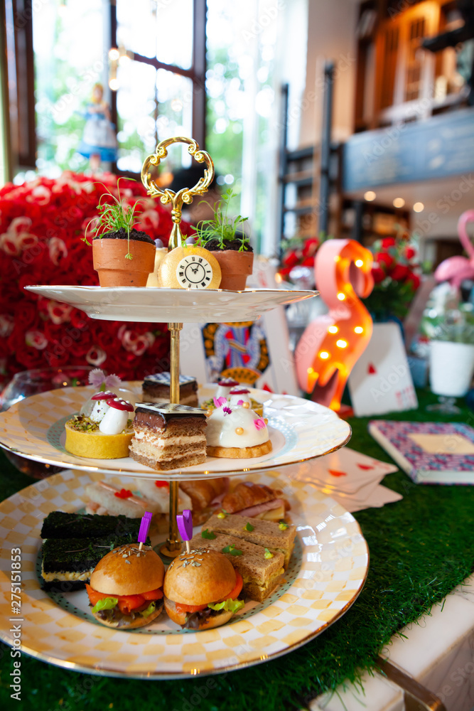 Magical and colorful set of afternoon tea in Alice in Wonderland theme ...