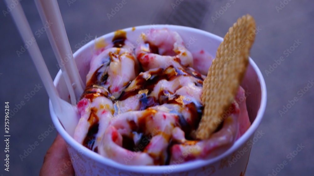 Ice cream "ice wave" in a cup. Street food. Walking.Ice cream parlor ...