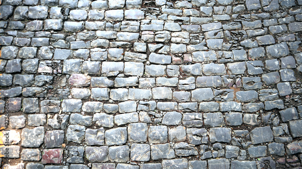 Top view on stone road close up. Old pavement of granite. Brown square ...