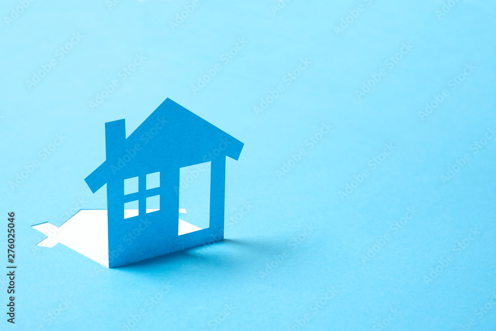 Concept of house in paper on blue color background for real estate ...