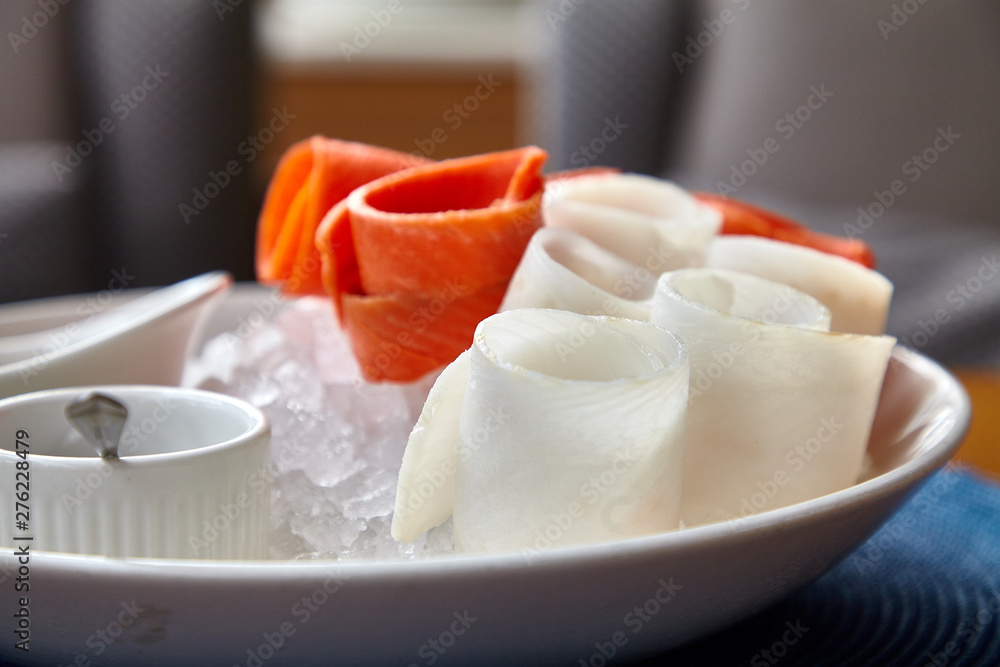Stroganina, a traditional dish in Siberia. Raw frozen fish sliced into ...