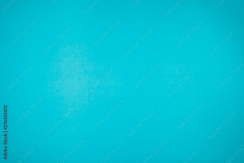 A little mottled bright blue turquoise paper plain and solid for minimal object background ...