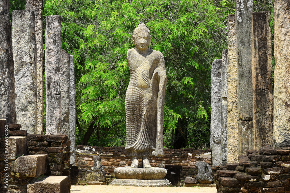 Sacred Quadrangle with standing statue of Lord buddha and stone pillars ...